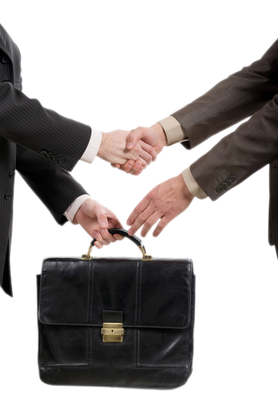 shaking hands and transfer briefcase – Nonprofit Law Blog